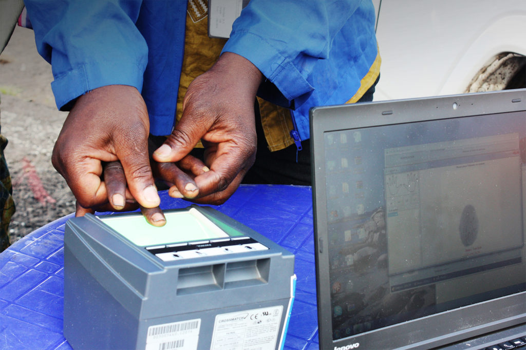 A biometric fingerprint system in use in an IDP camp in North Kivu ...